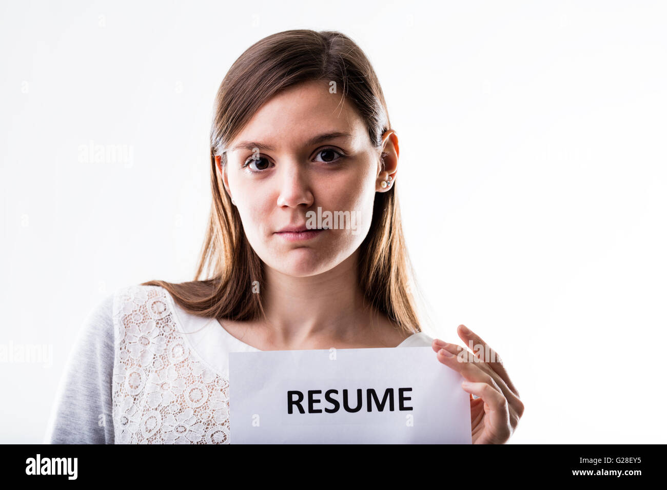 determined woman holding a resume on a white background Stock Photo - Alamy