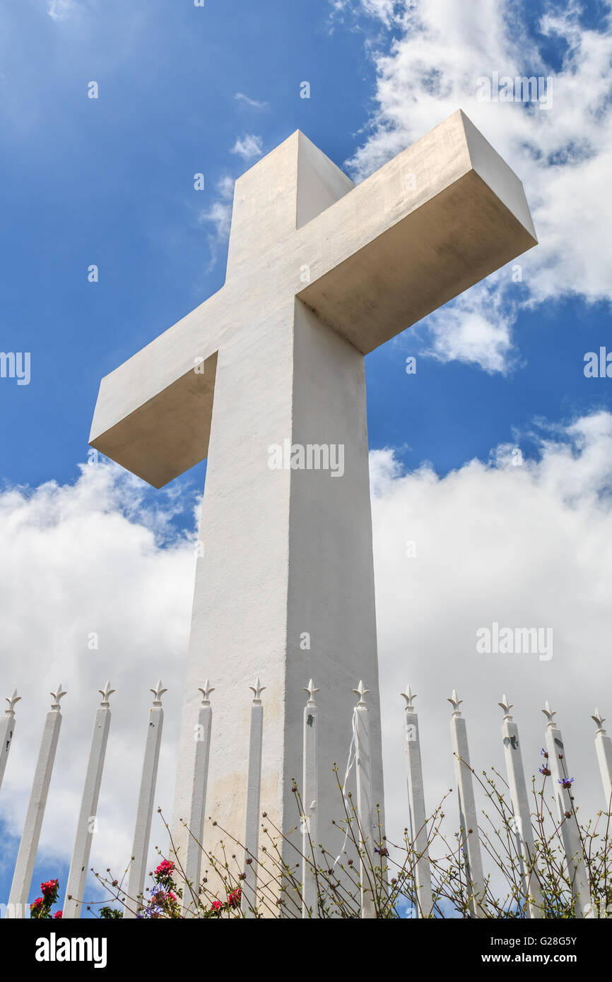 The historic Mt. Helix cross with fence railing and a background of a ...