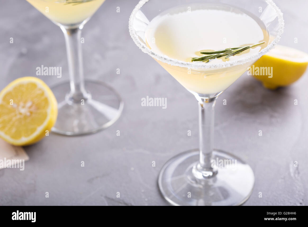 Lemonade martini with rosemary Stock Photo - Alamy