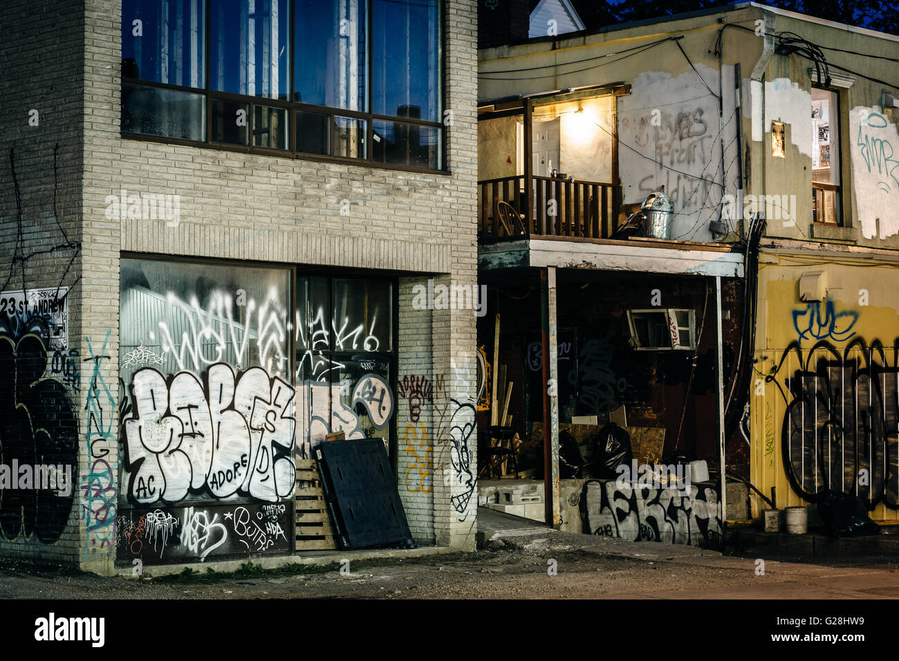 Graffiti on buildings in Kensington Market at night, Toronto, Ontario ...