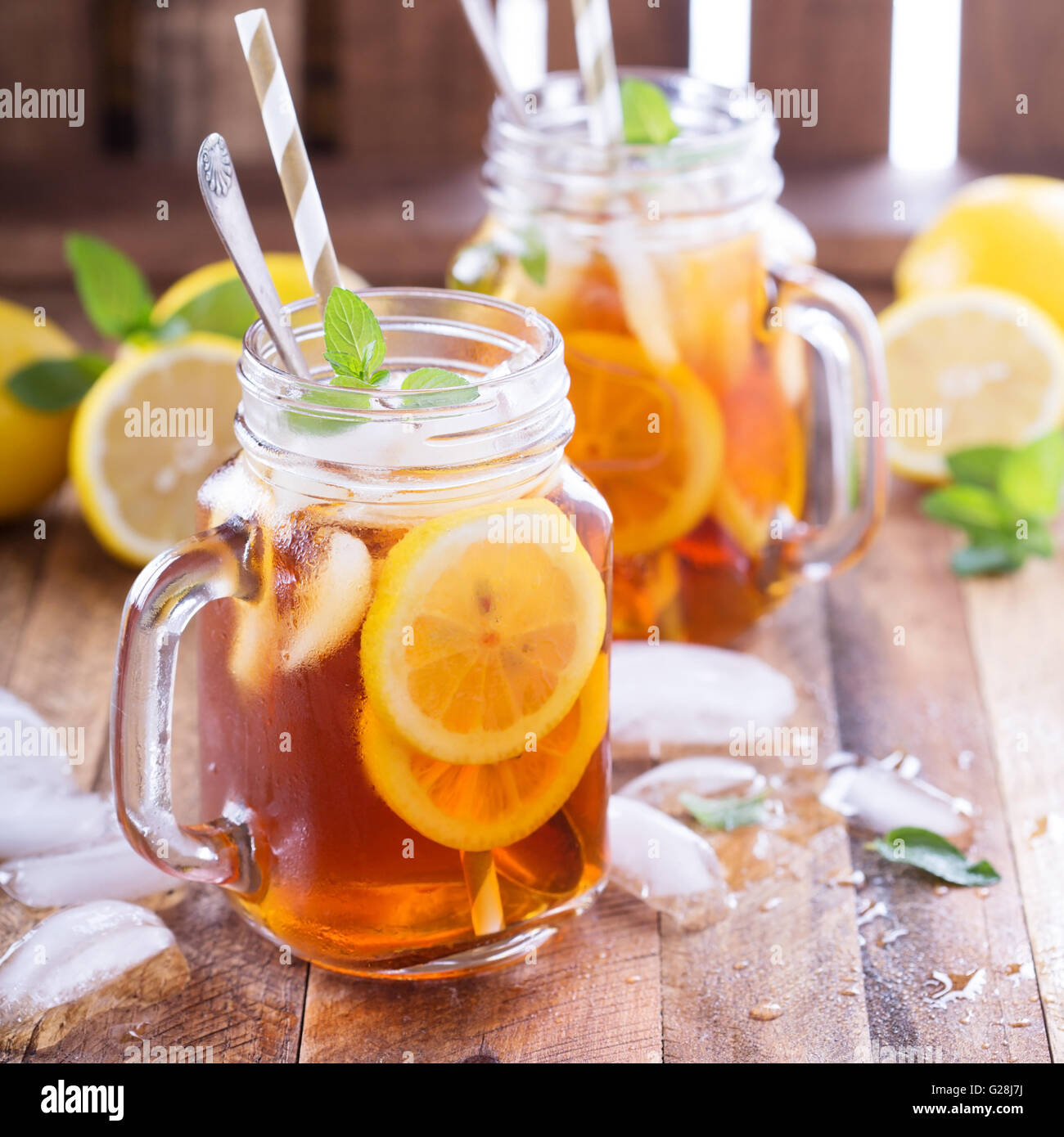 Iced tea with lemon slices Stock Photo - Alamy