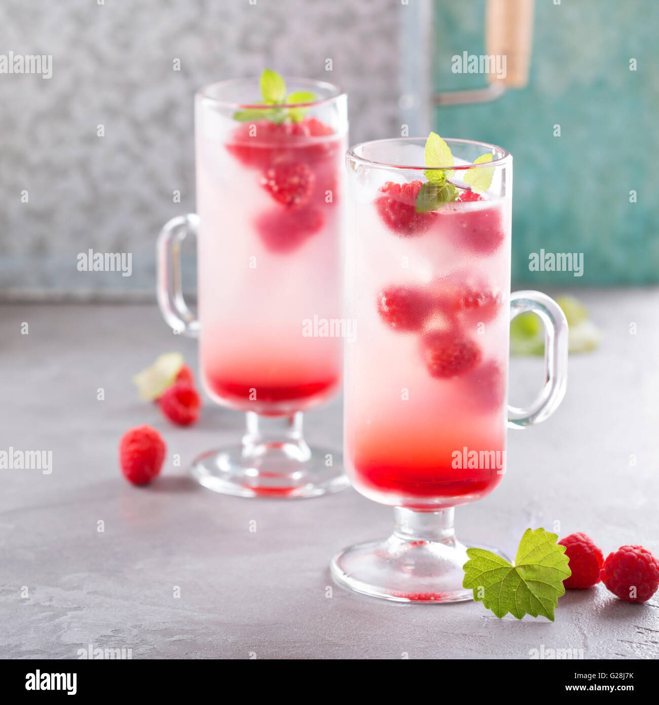 Pink raspberry lemonade in tall glasses Stock Photo - Alamy