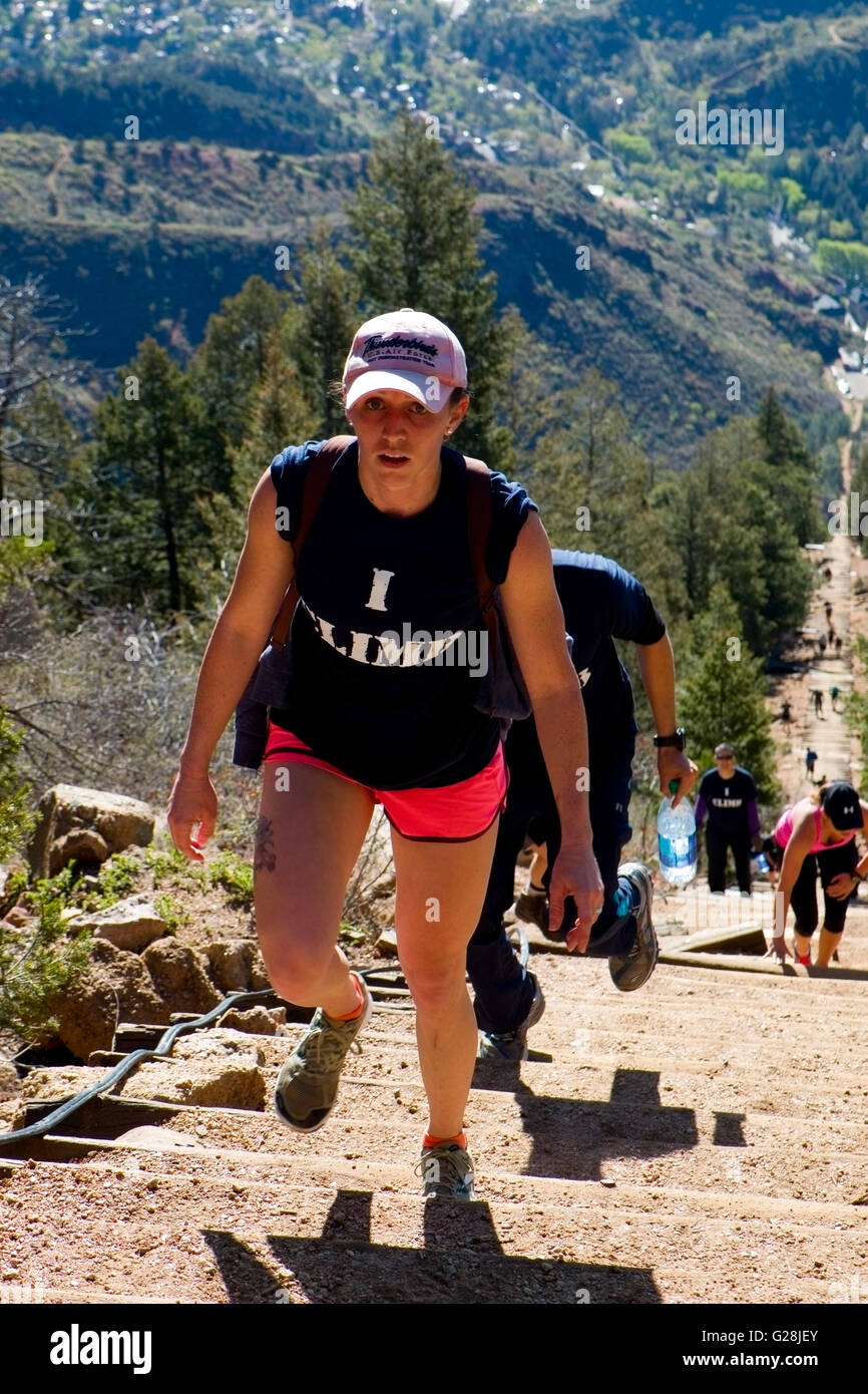 Hikers climbing the Manitou Incline and descending via the Barr Trail ...