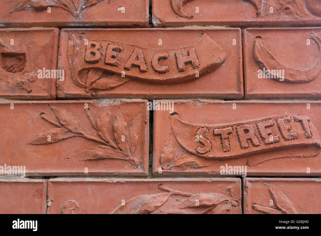 street sign created in terra cotta bricks in the facade of a NYC ...