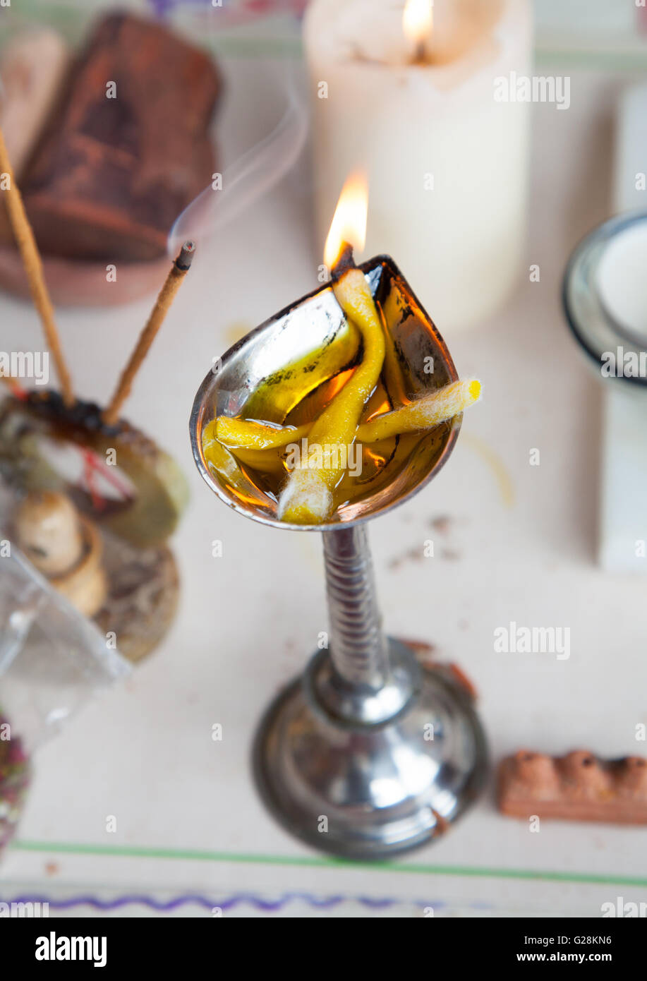 Close up detail as a Hindu priest conducts a Anaprasan religious ...