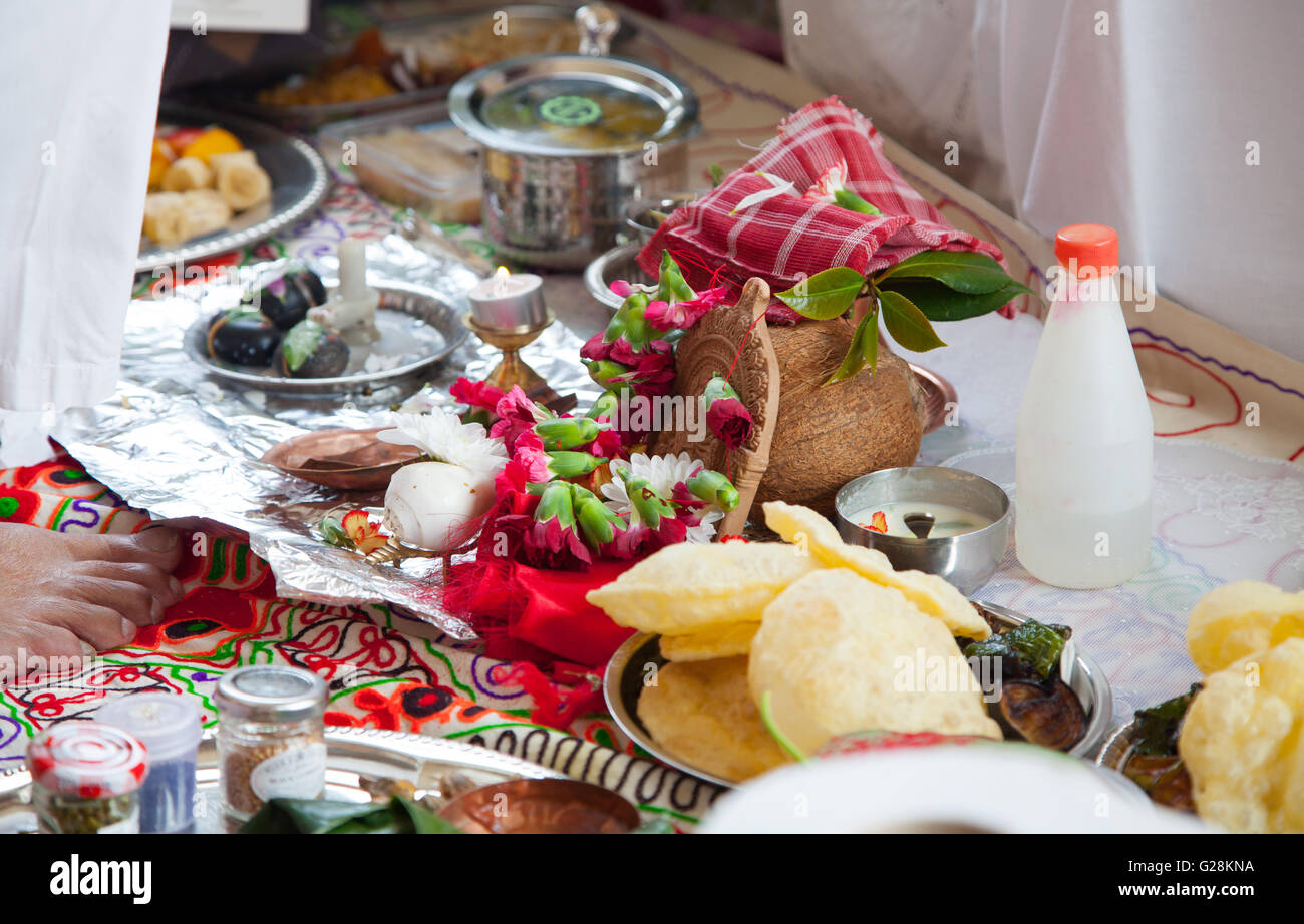 Close up detail as a Hindu priest conducts a Anaprasan religious ...