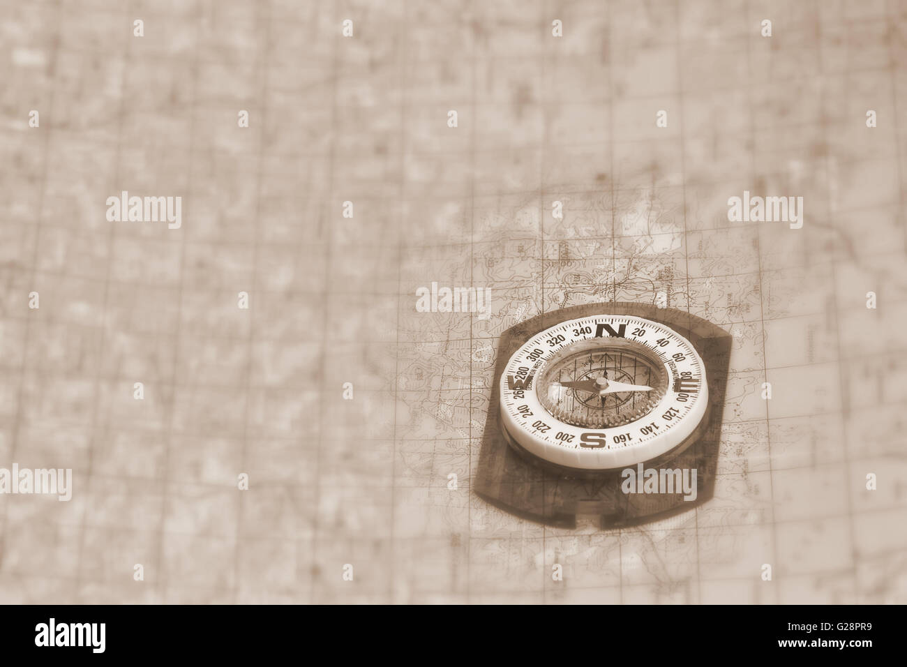 Orienteering using a map and compass. Magnetic compass on a topographic ...