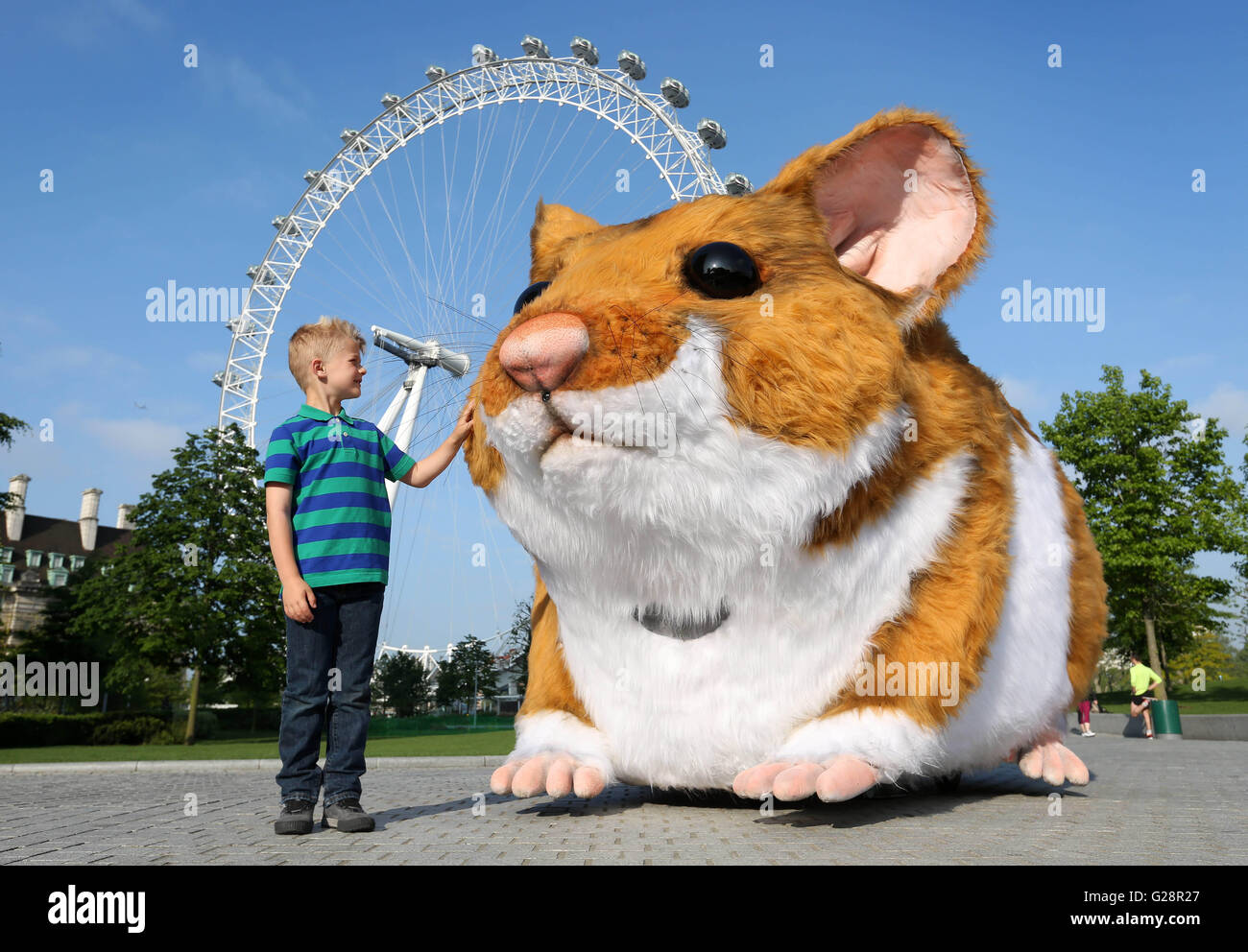 EDITORIAL USE ONLY Oliver Morris, age 6 from Kent, interacts with a ...