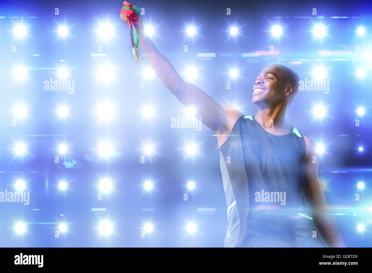 Composite image of portrait of happy sportsman raising his medal Stock ...