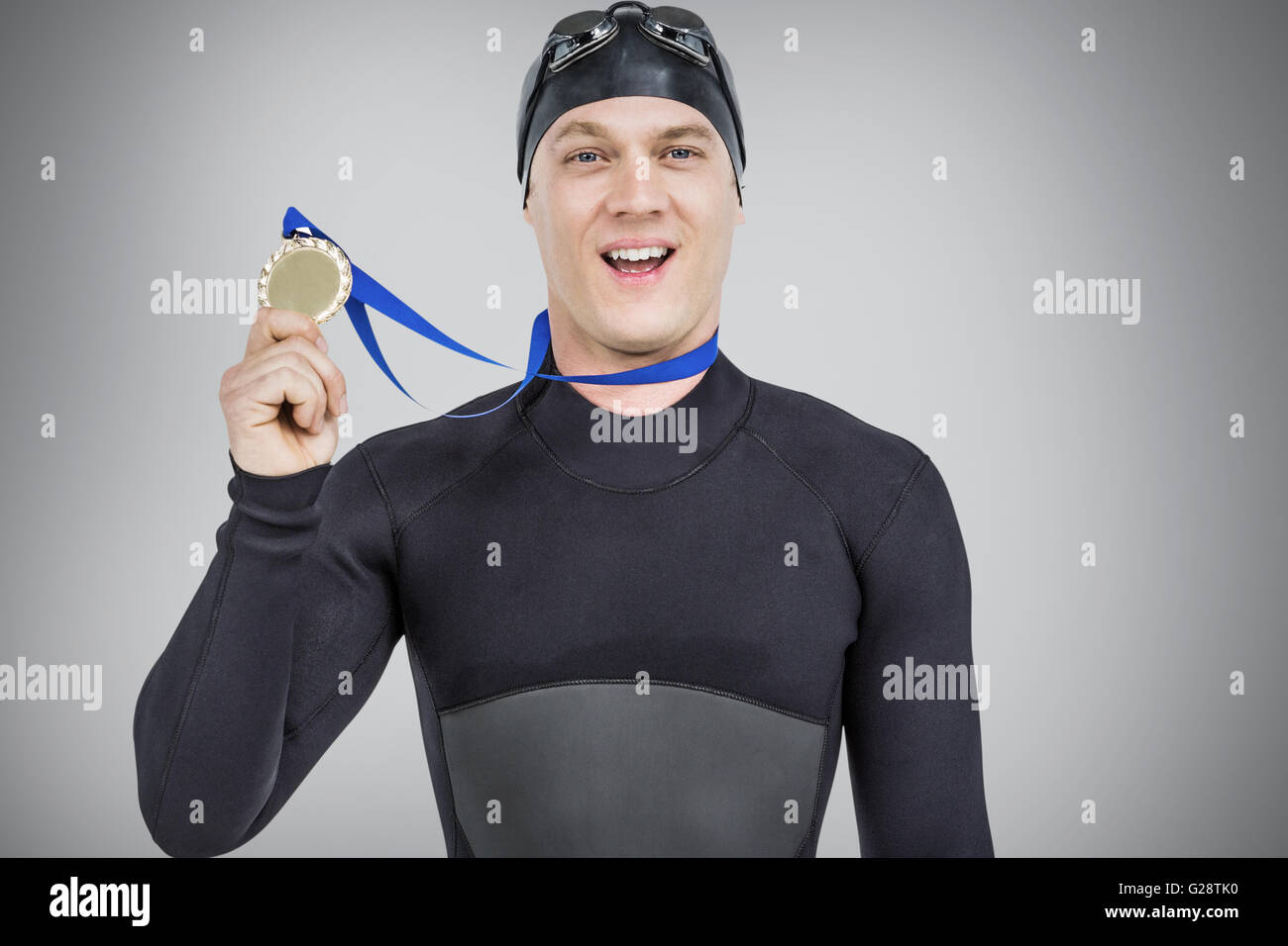 Composite image of swimmer showing his gold medal Stock Photo - Alamy