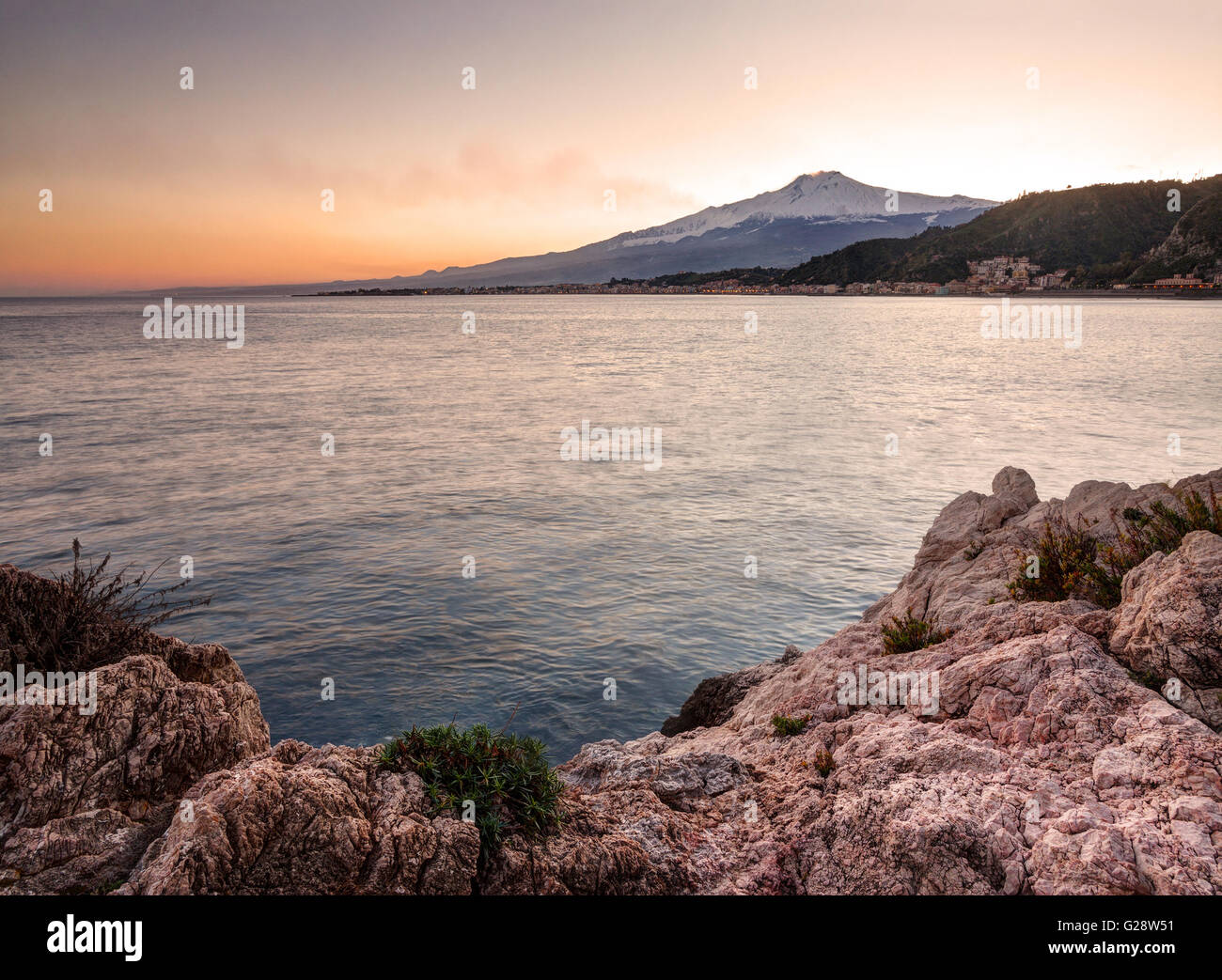 Sicily, Italy: Mount Etna seen from Taormina at sunset Stock Photo - Alamy