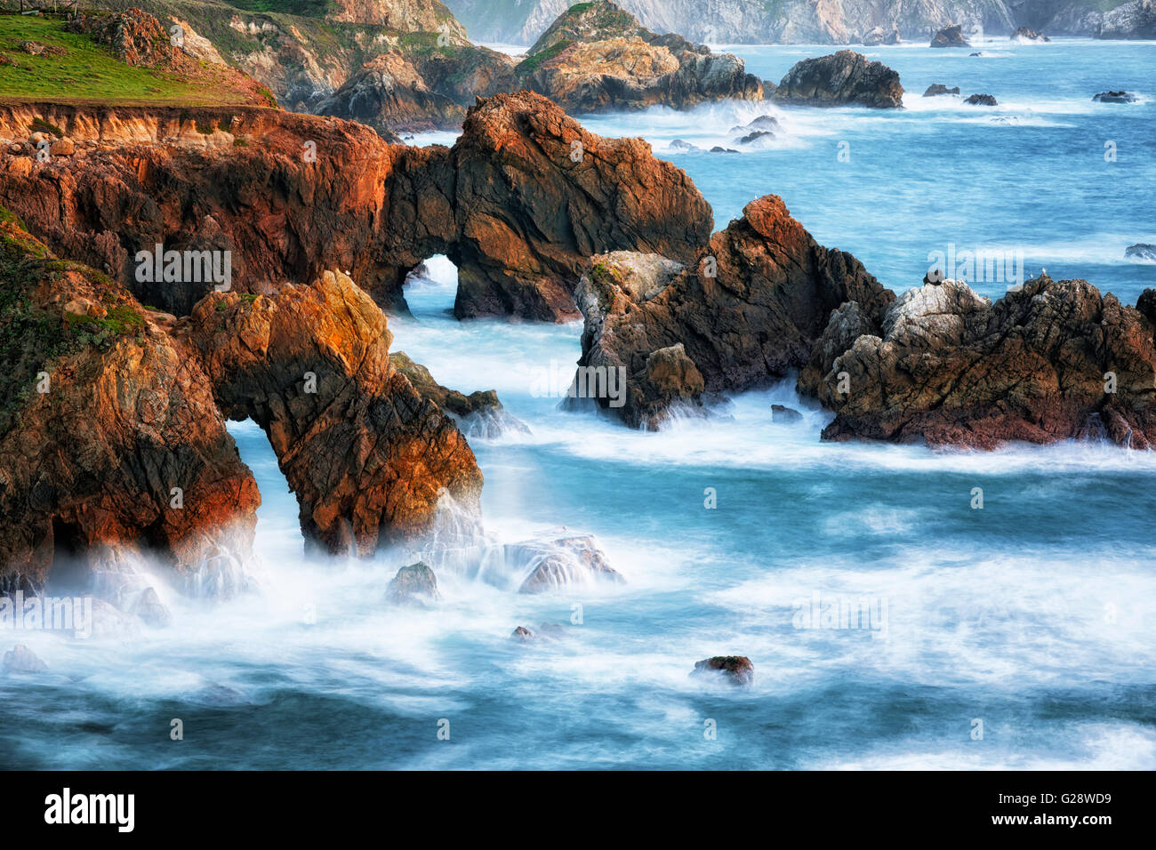 Evening glow on the many sea stacks and sea arches along California’s ...