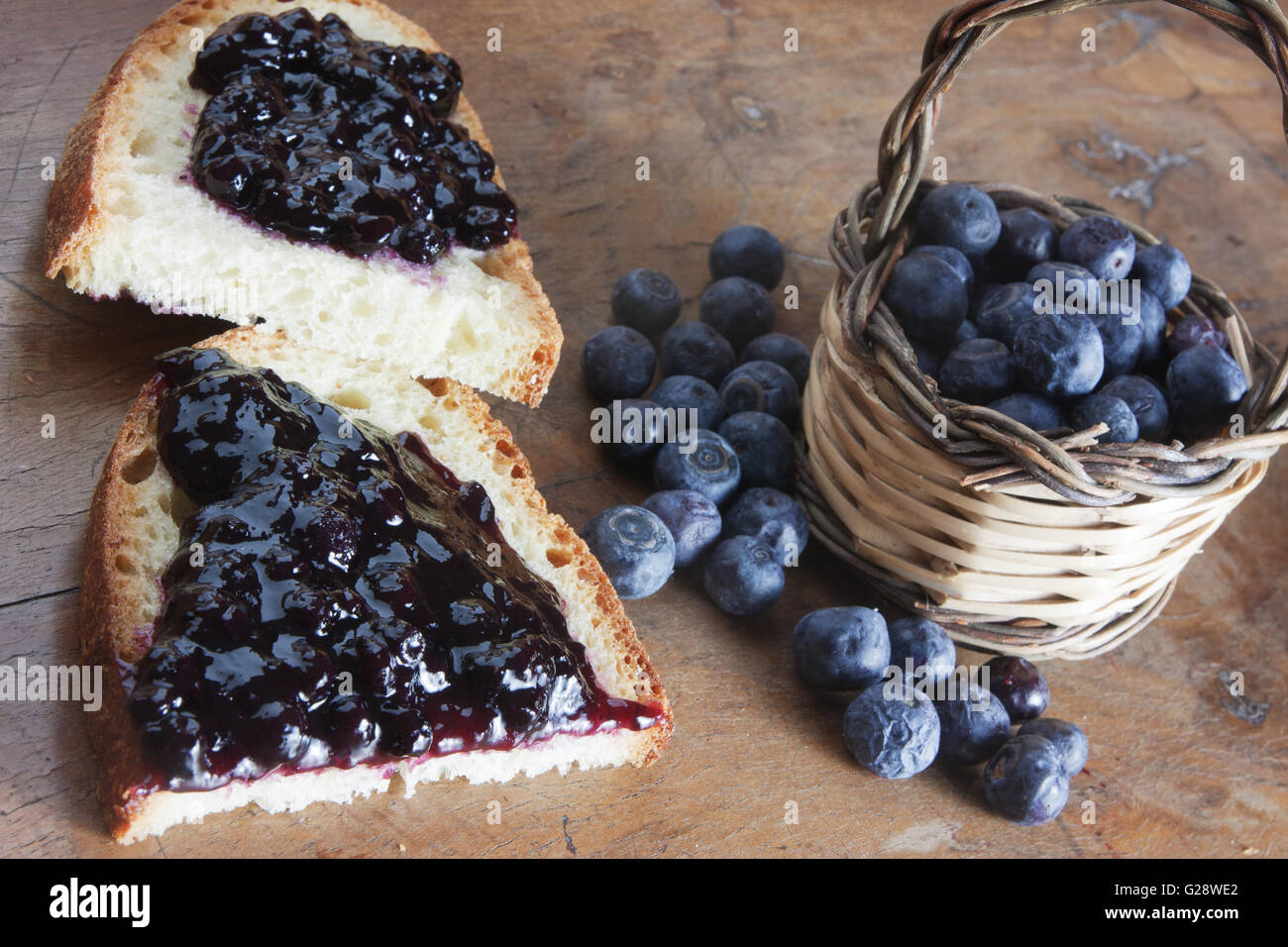 blueberry jam with bread and blueberry in a wicker basket Stock Photo ...