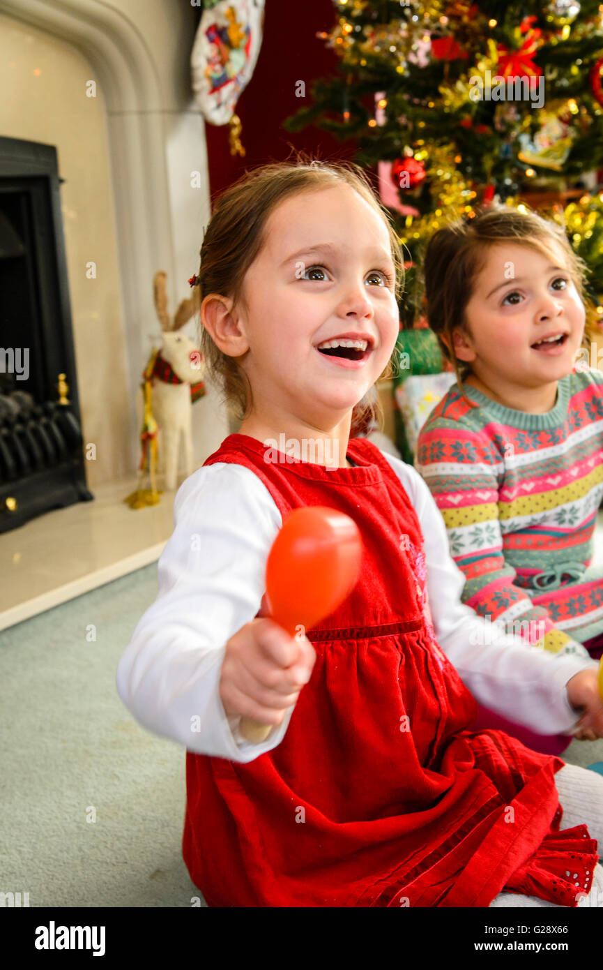 Kids playing in the house at Christmas Stock Photo - Alamy