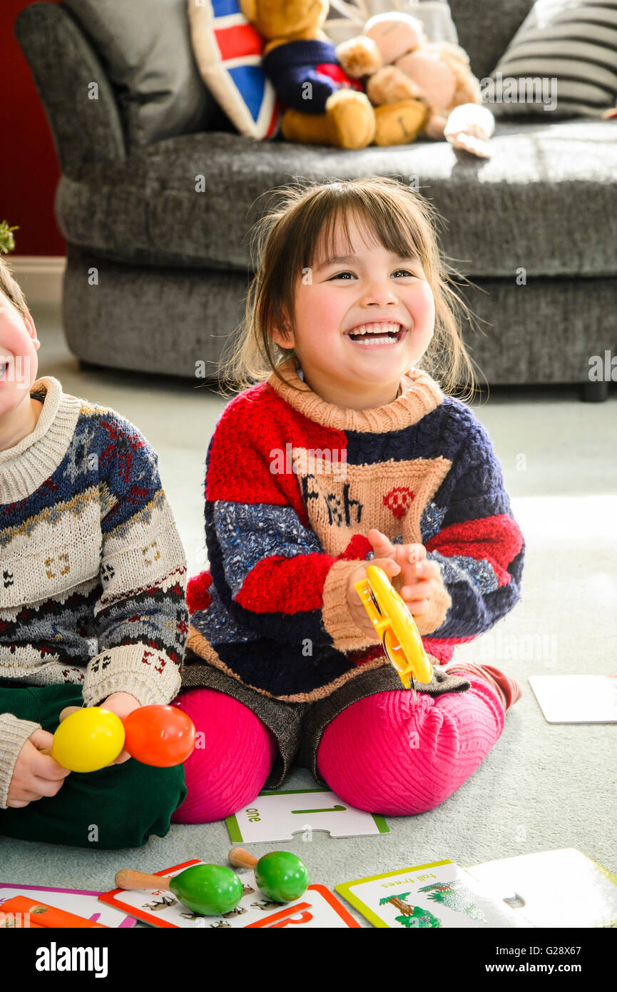 Kids playing in the house at Christmas Stock Photo - Alamy