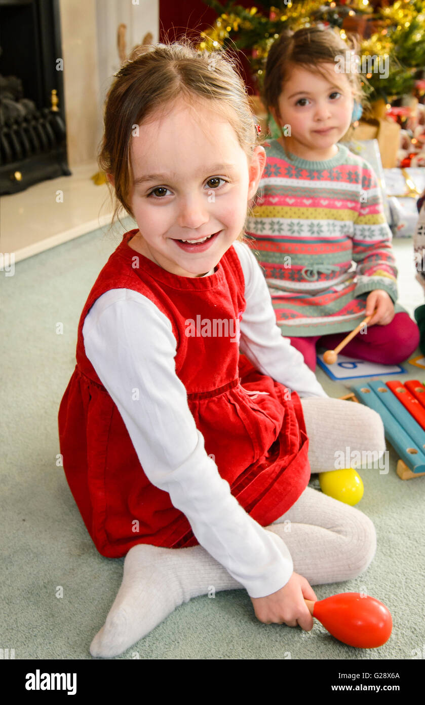 Kids playing in the house at Christmas Stock Photo - Alamy