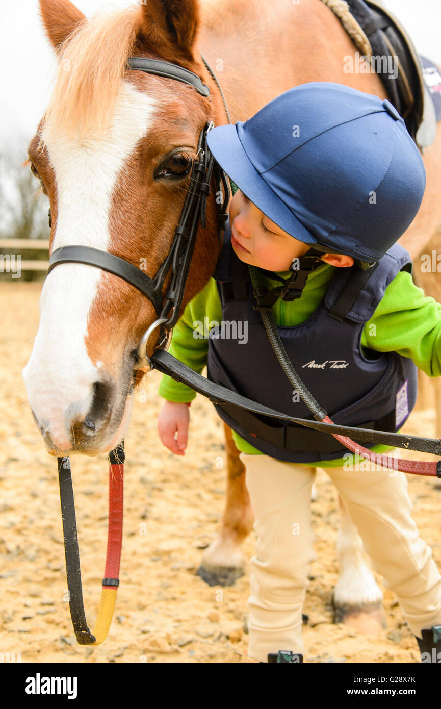 Kid with horse Stock Photo - Alamy