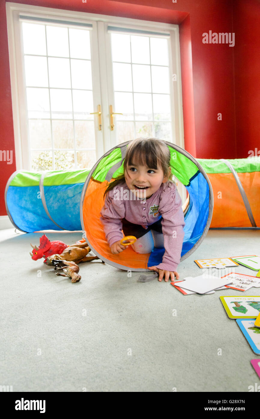 Kid playing in the house Stock Photo - Alamy