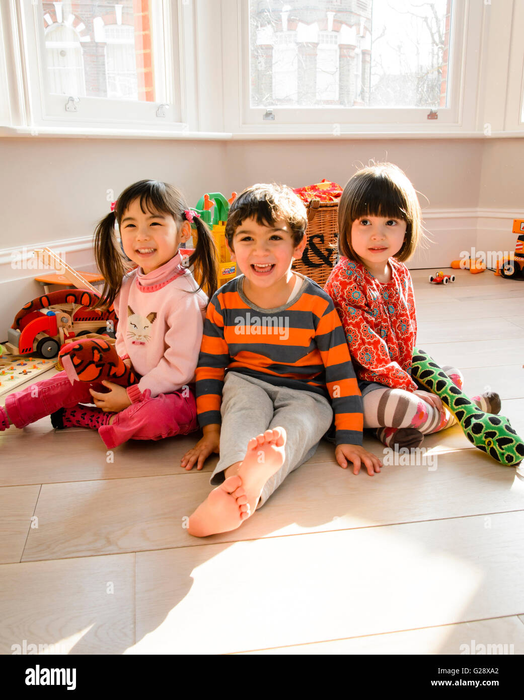 Kids playing in the house Stock Photo - Alamy