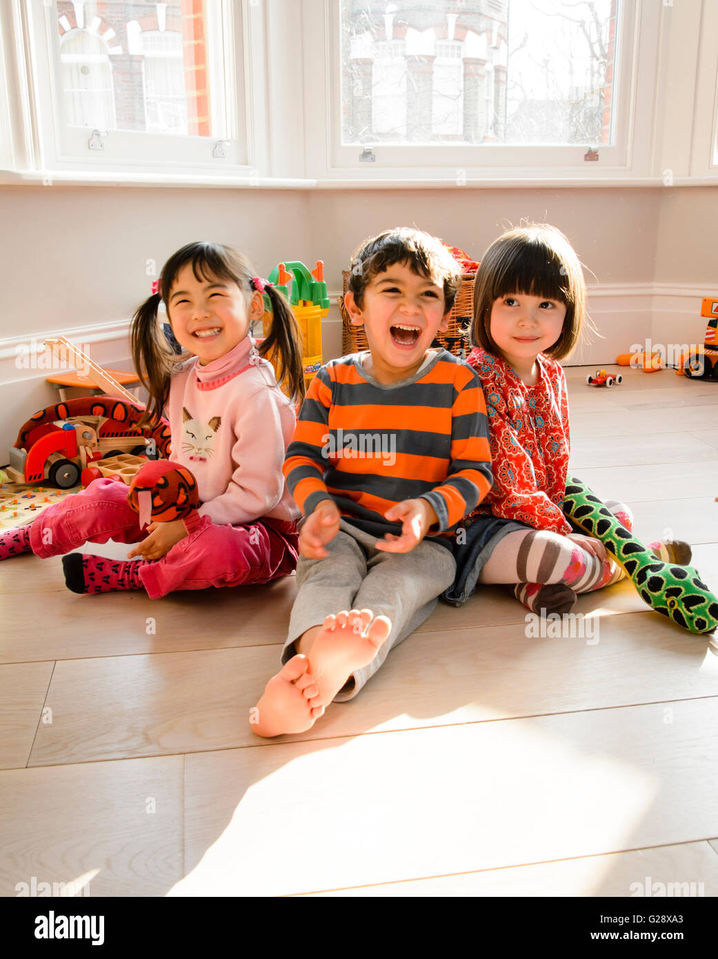 Kids playing in the house Stock Photo - Alamy