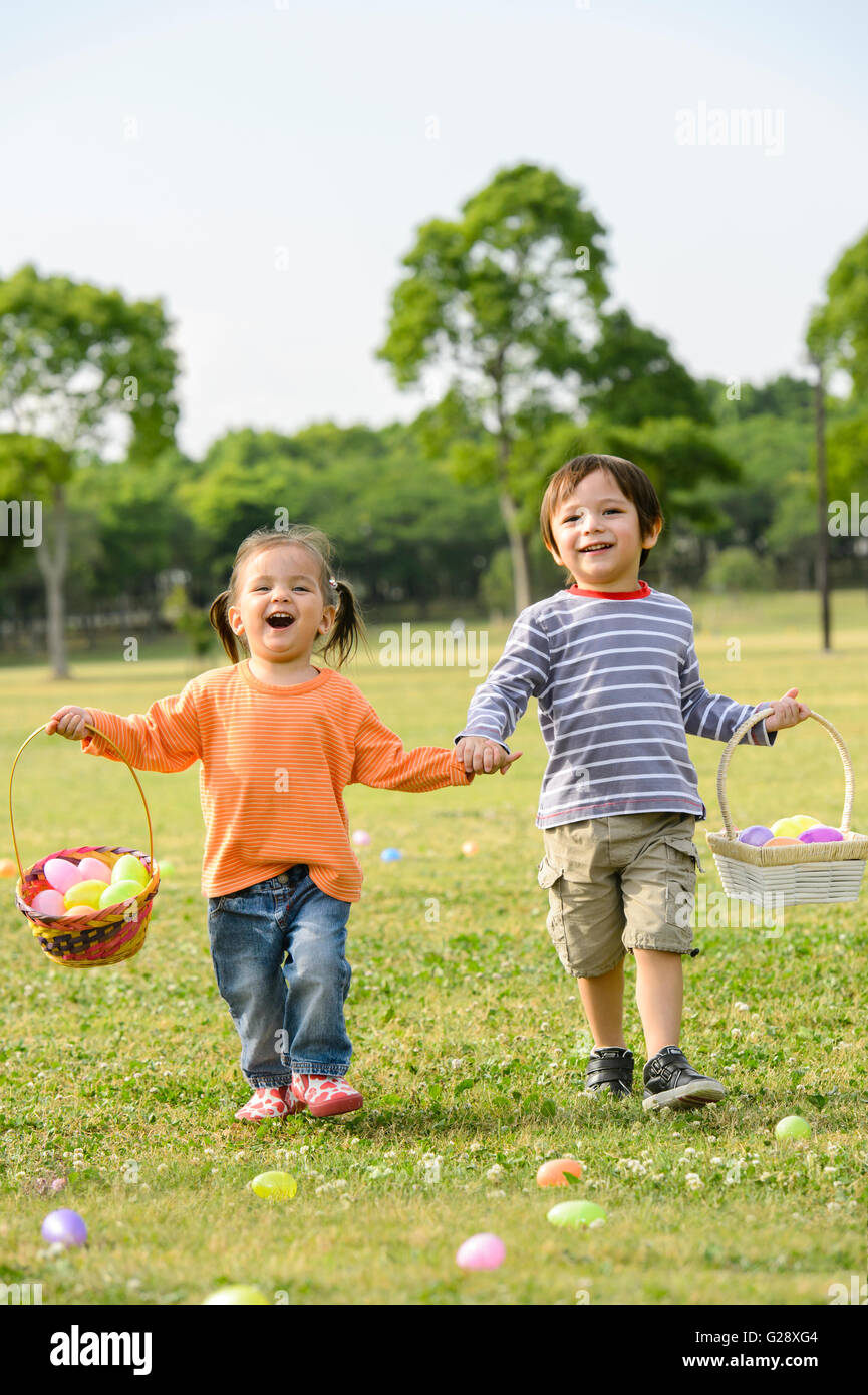 Kids playing in a city park Stock Photo - Alamy