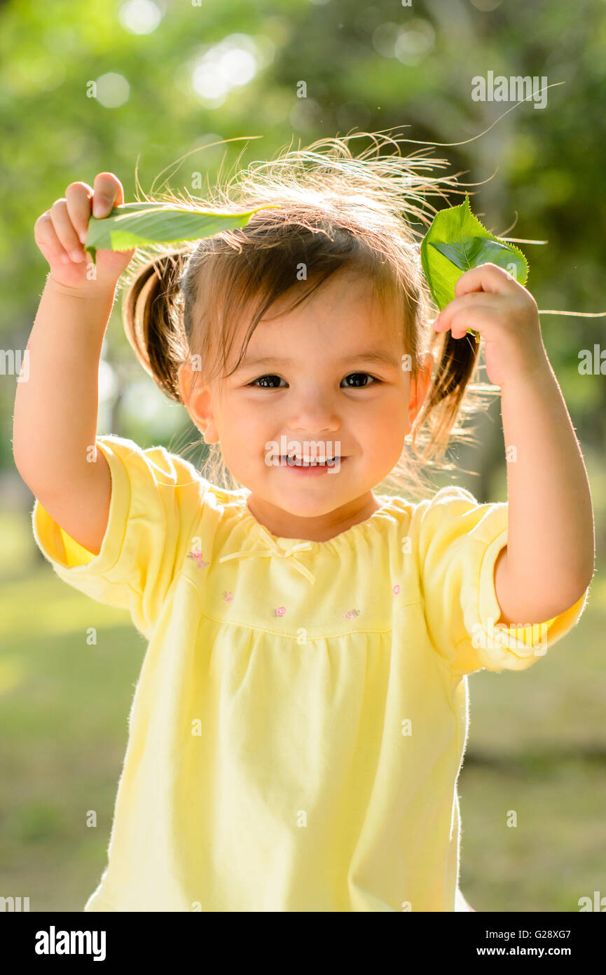 Kid playing in a city park Stock Photo - Alamy