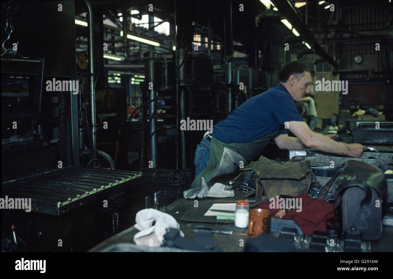 man working in rubber factory Stock Photo - Alamy