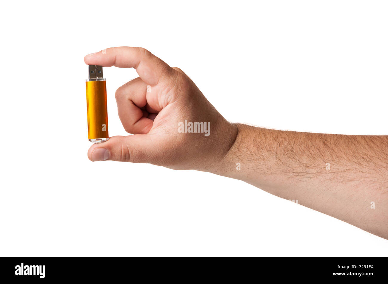 An usb memory stick hold between fingers hi-res stock photography and ...