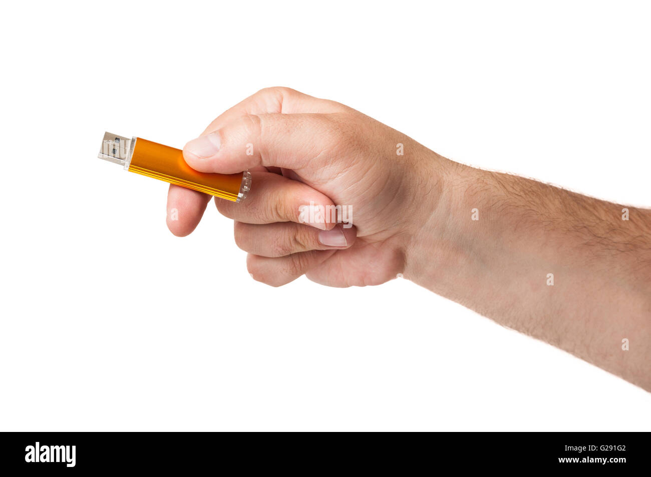 A male hand holding a golden usb memory stick on a white background ...
