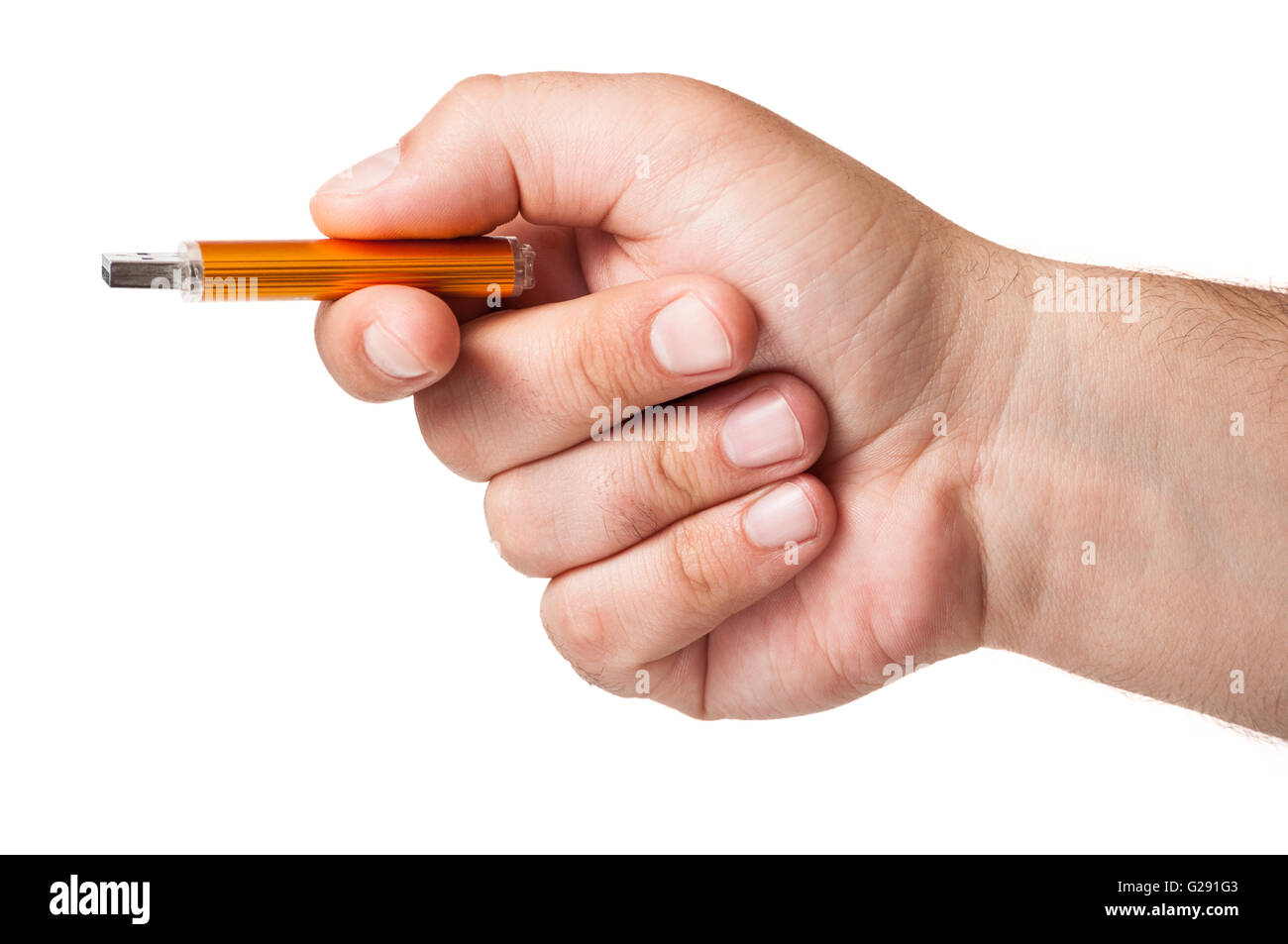 An usb memory stick hold between fingers, isolated on a white ...