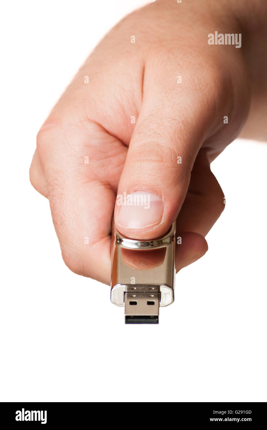 Male hand and a business usb flash drive isolated on a white background ...