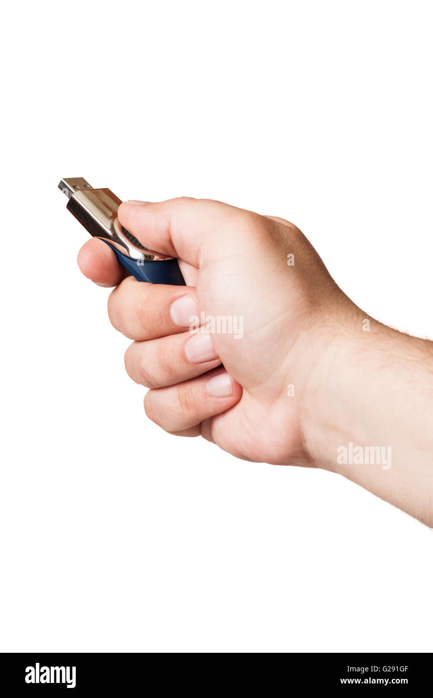 A hand and an usb flash memory stick on a white background isolated ...
