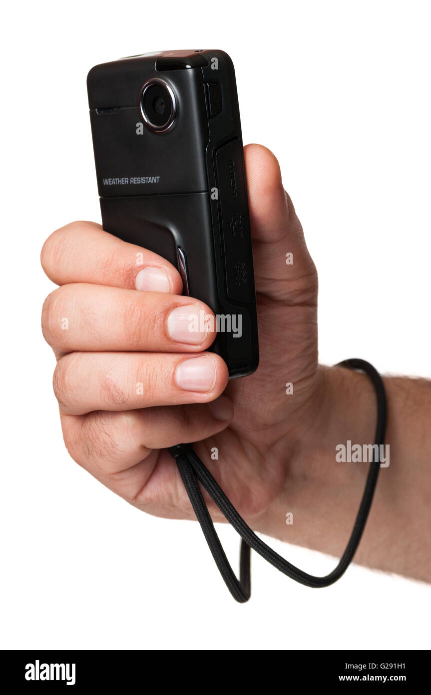 White hand holding a mini video camera on a white background Stock ...