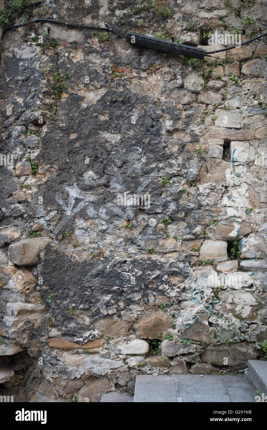 Weathered and decayed old stone wall in Bilbao, Spain Stock Photo - Alamy