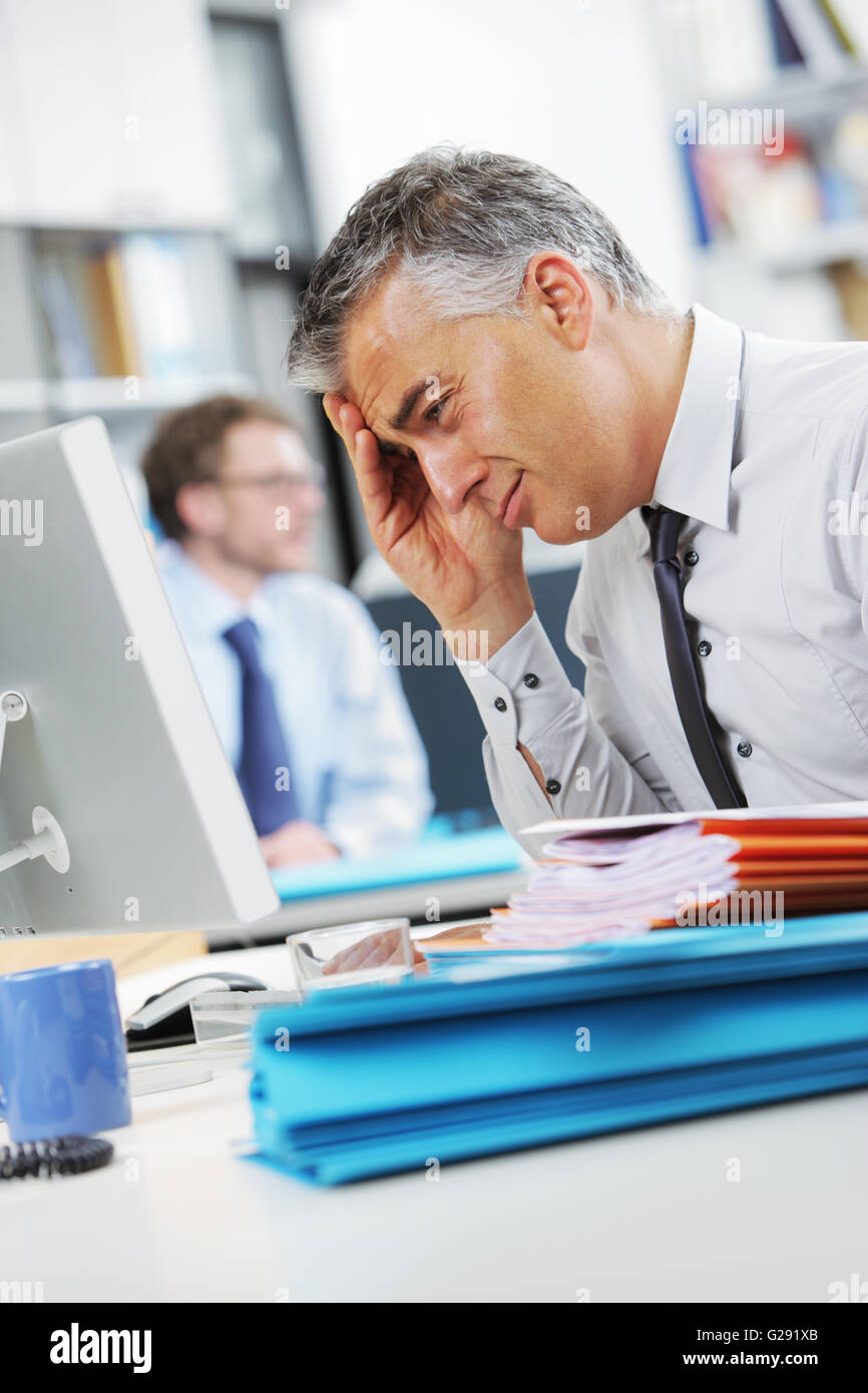 Businessman under stress, fatigue and headache Stock Photo - Alamy