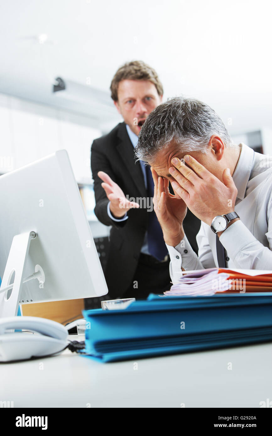 Mature manager shouting at his office worker Stock Photo - Alamy