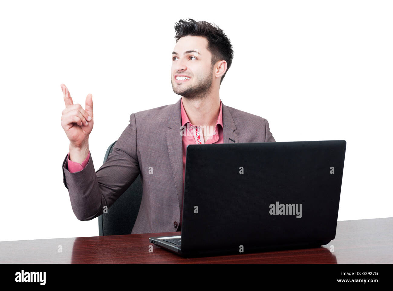 Elegant business man with a fancy suit sitting at his desk with a ...
