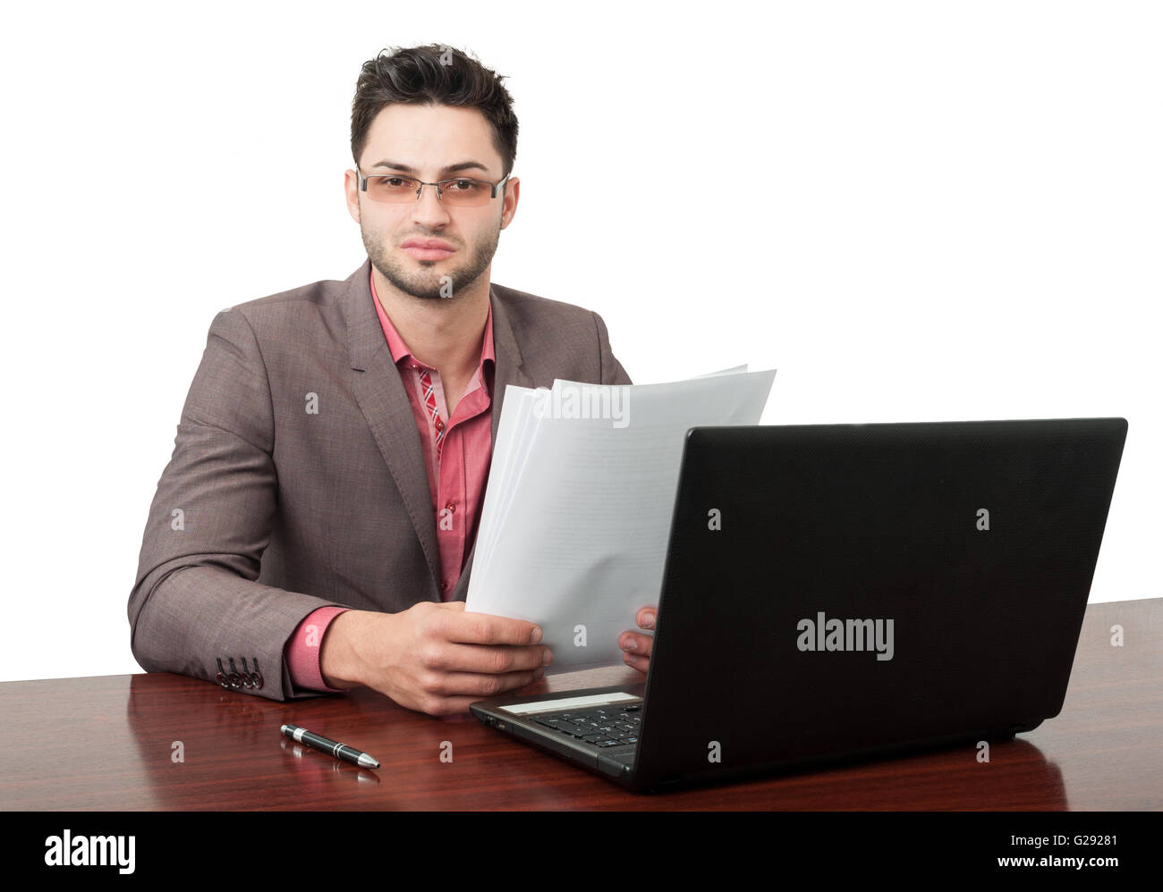 Handsome brunet male manager looking into the camera from his office ...