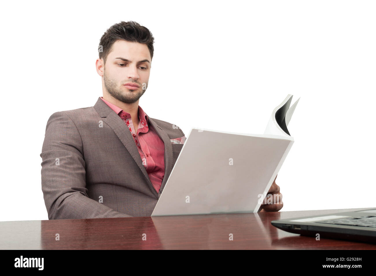 Man sitting desk reading magazine hi-res stock photography and images ...