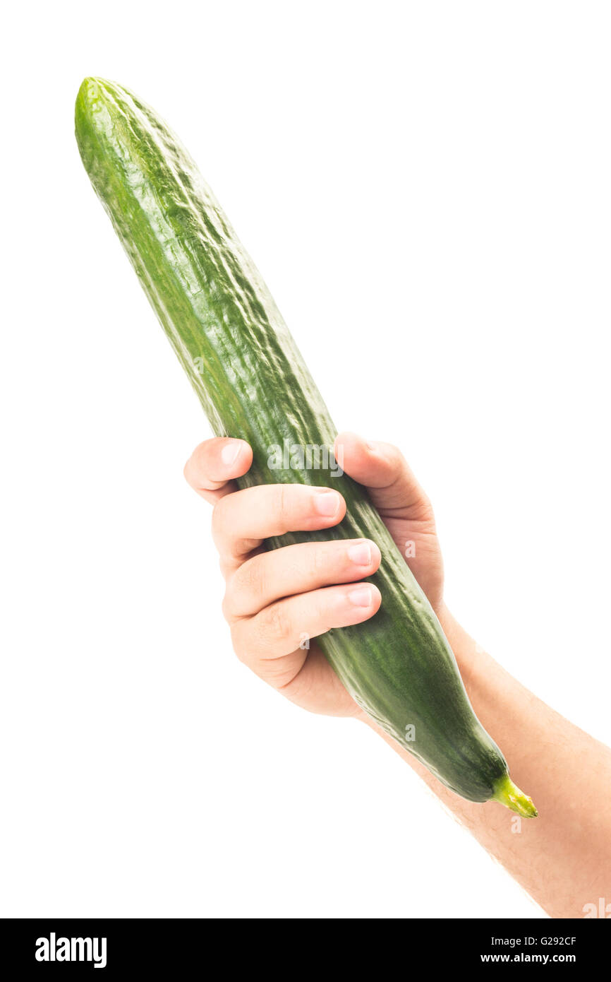 White male hand holding a big fresh green cucumber isolated on white ...