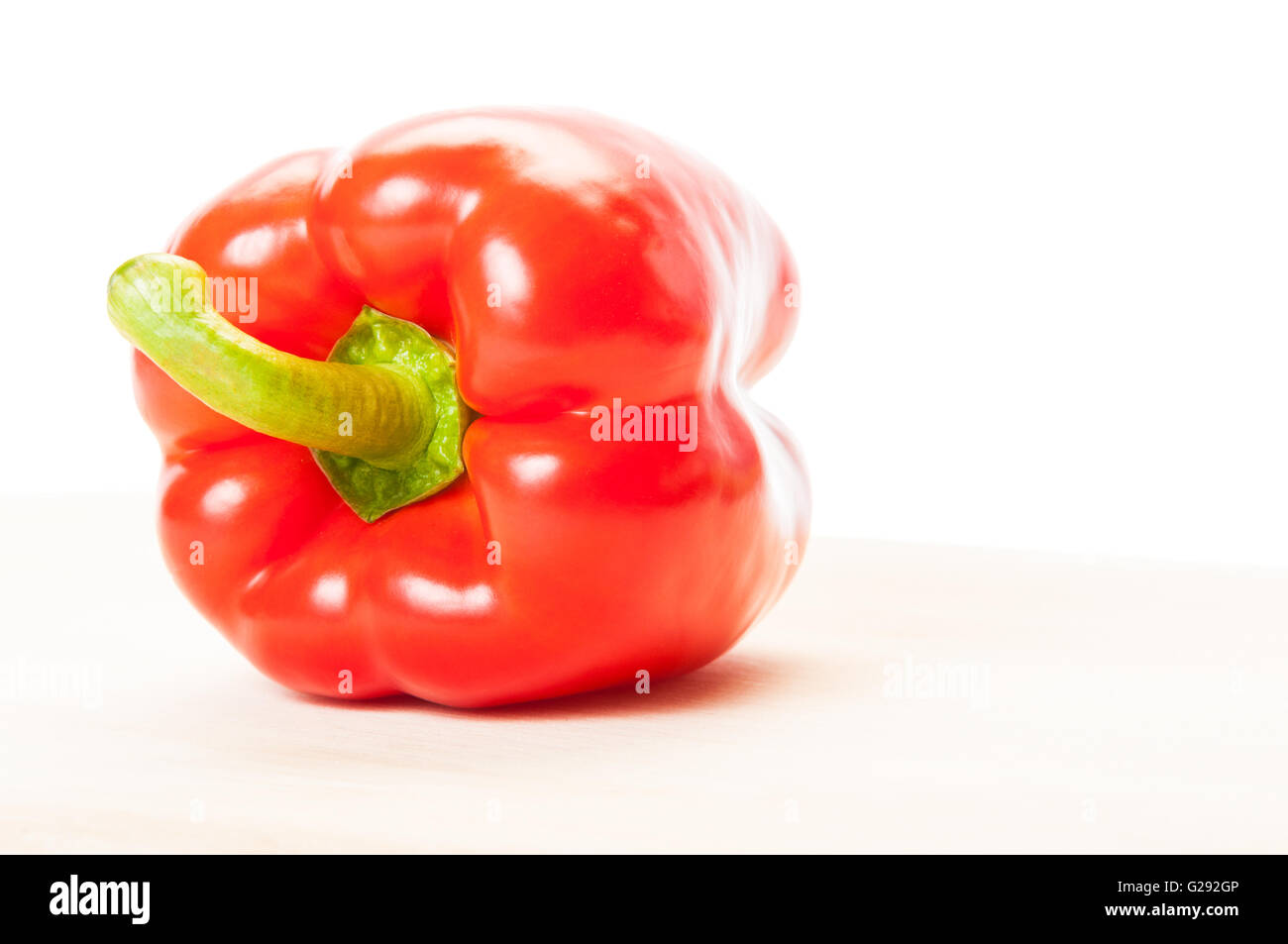 Clean closeup with one big fat red pepper with beautiful colour and ...