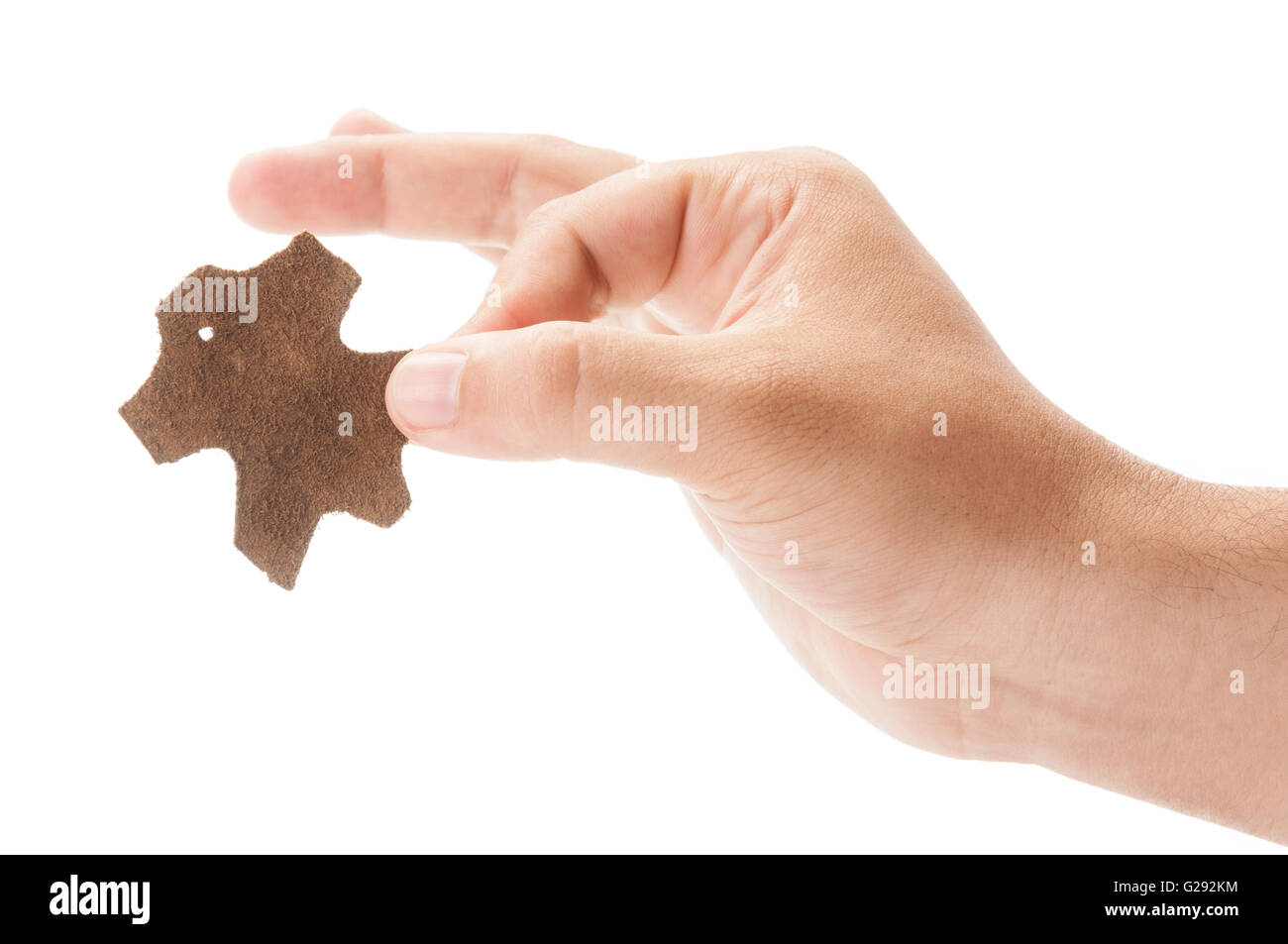 Hand holding an original leather sign made 100% of real leather. Photo ...