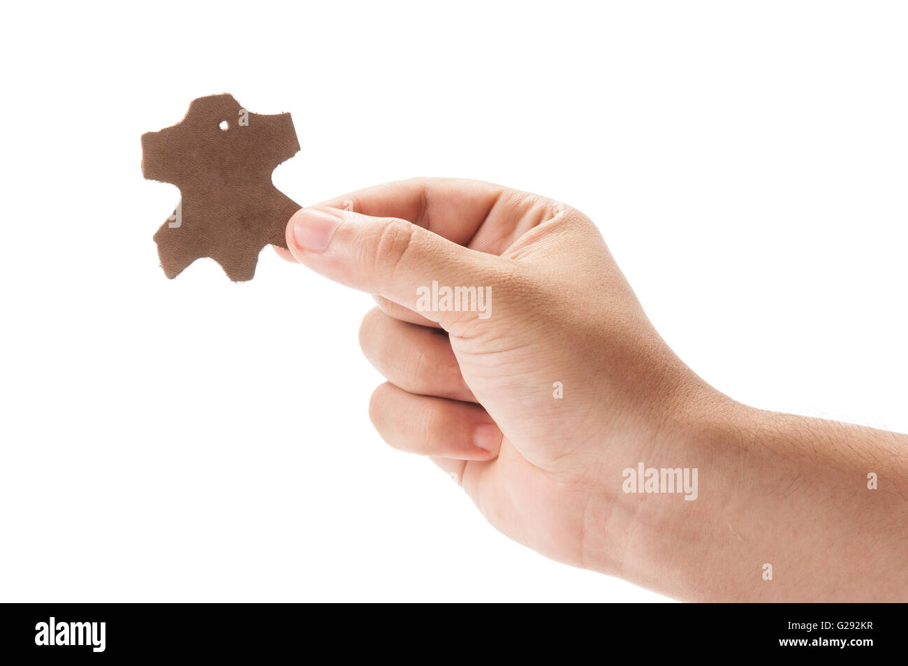 Hand holding made leather symbol hi-res stock photography and images ...