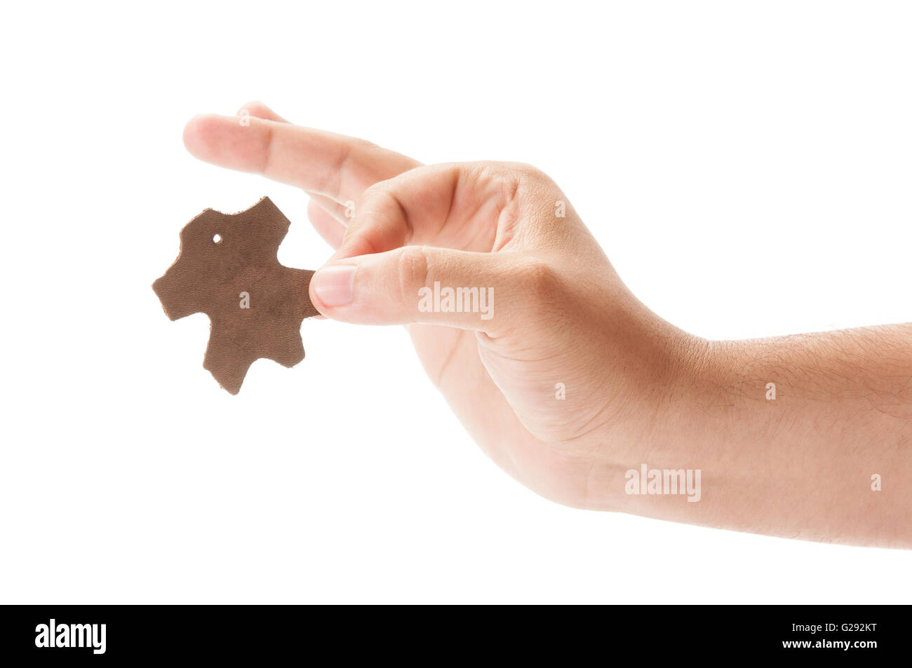 Hand holding made leather symbol Cut Out Stock Images & Pictures - Alamy