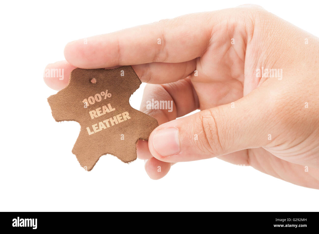 Hand holding made leather symbol hi-res stock photography and images ...