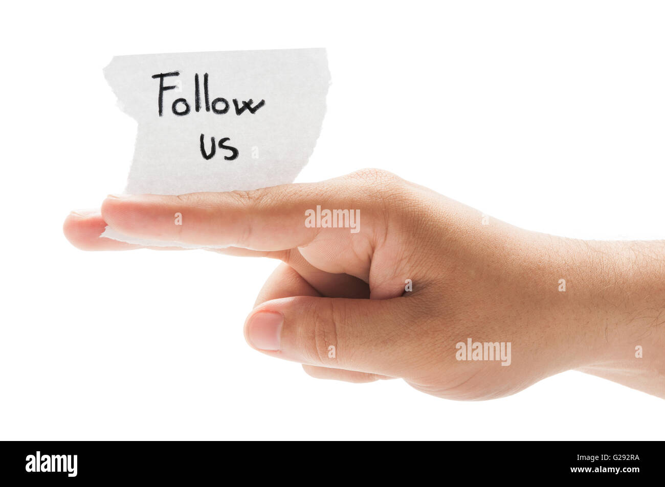 Follow us message concept using a hand holding a small piece of paper ...