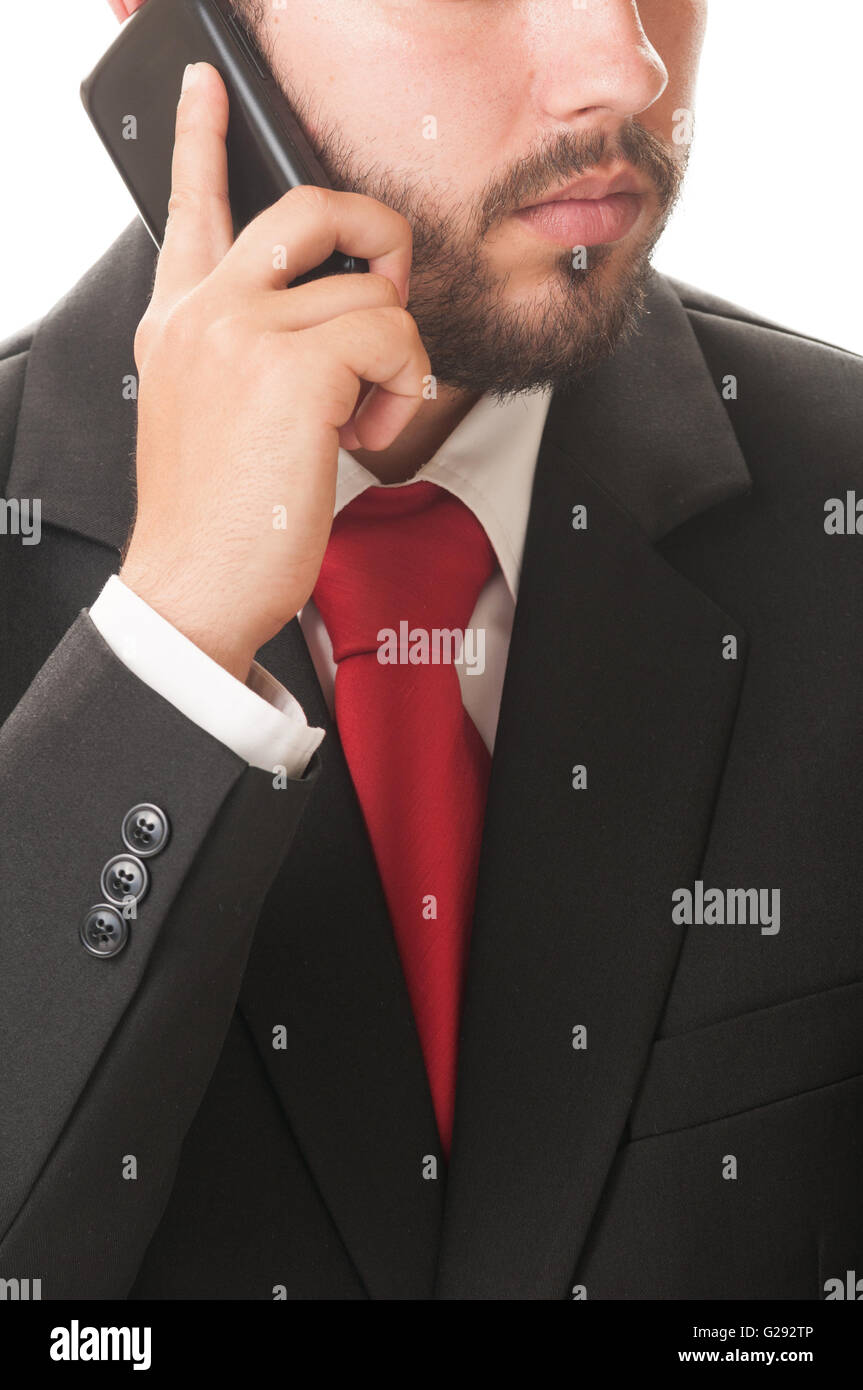 Business man talking on smartphone. He wears clasic black suit and red ...