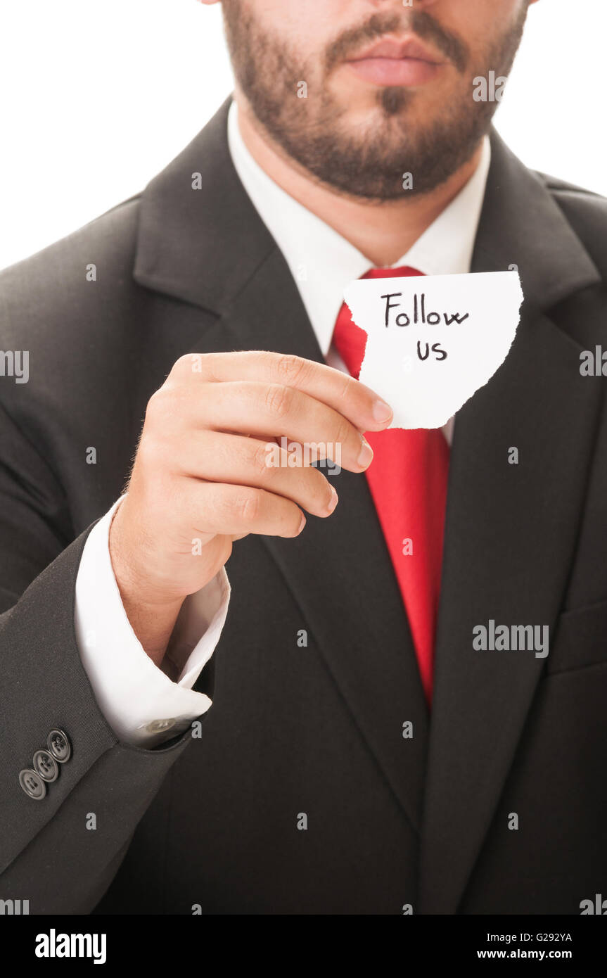 Follow us concept using a man wearing a black suit and red necktie and ...