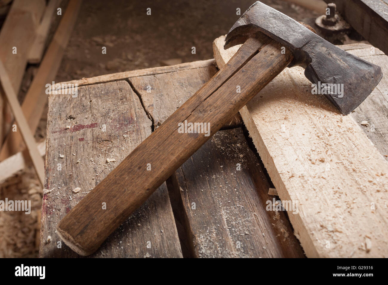 Old ax or hatchet on a wooded table in a carpenter workshop Stock Photo ...