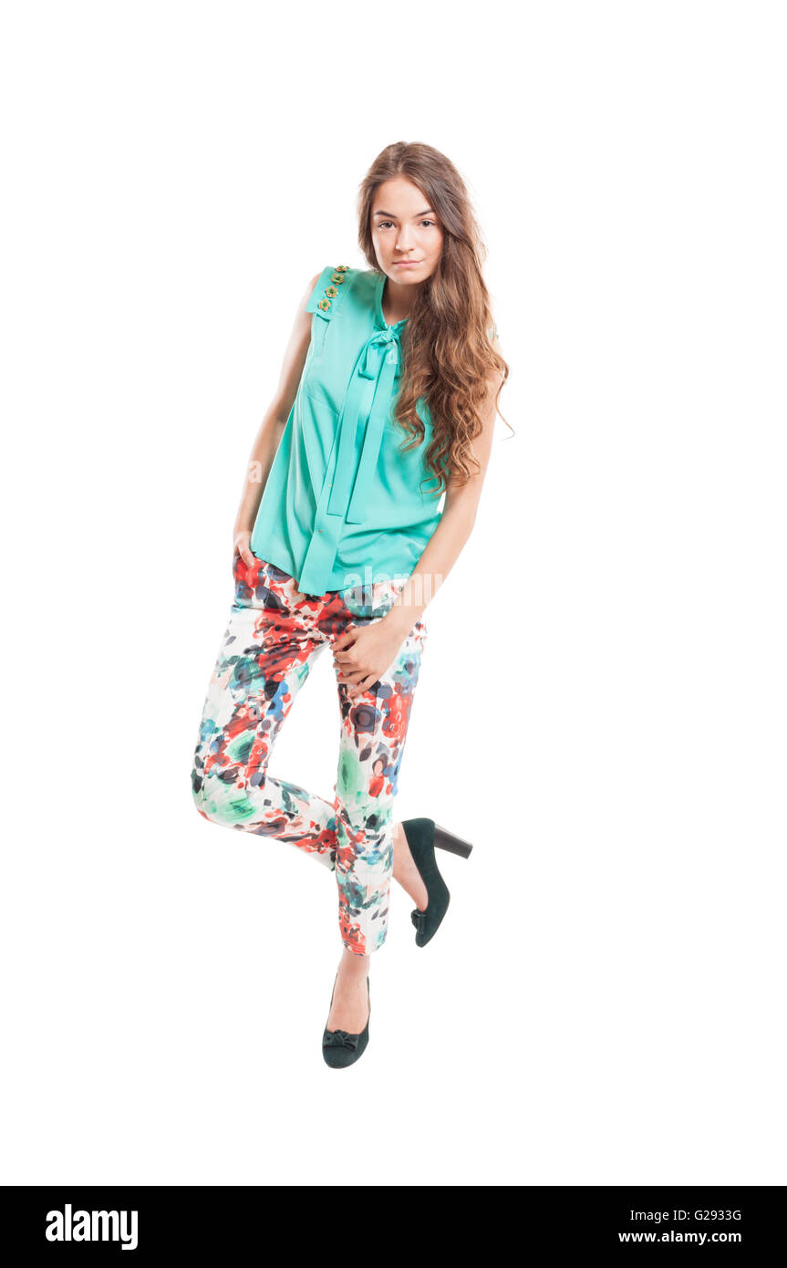 Beautiful female model posing standing in one leg isolated on white ...